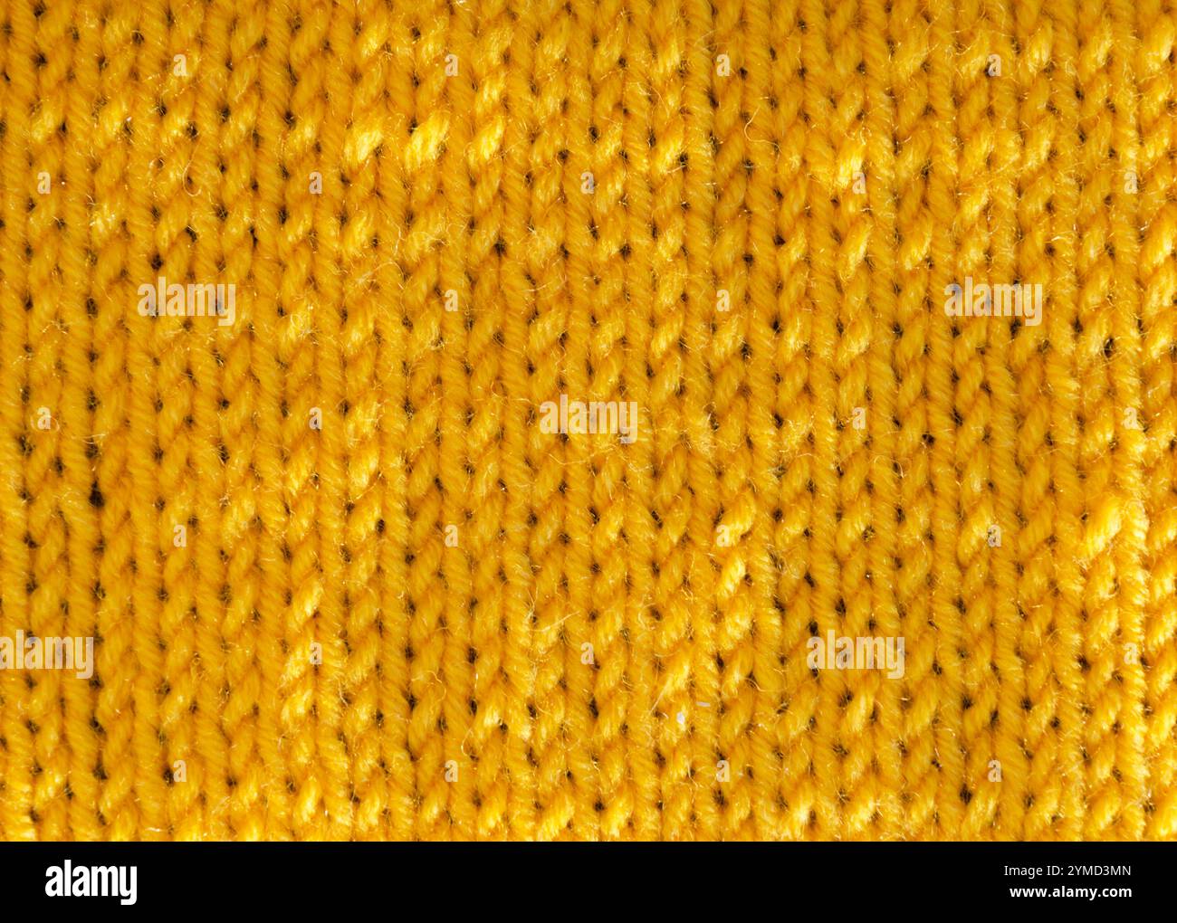 The texture of the satin stitch pattern is knitted with yellow wool ...