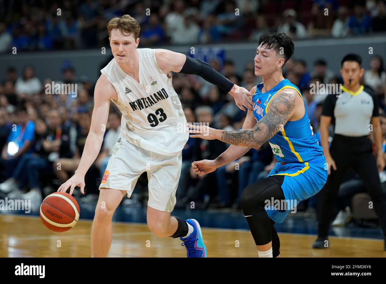 New Zealand's Sam Waardenburg, left, dribbles past Philippines' Dwight ...