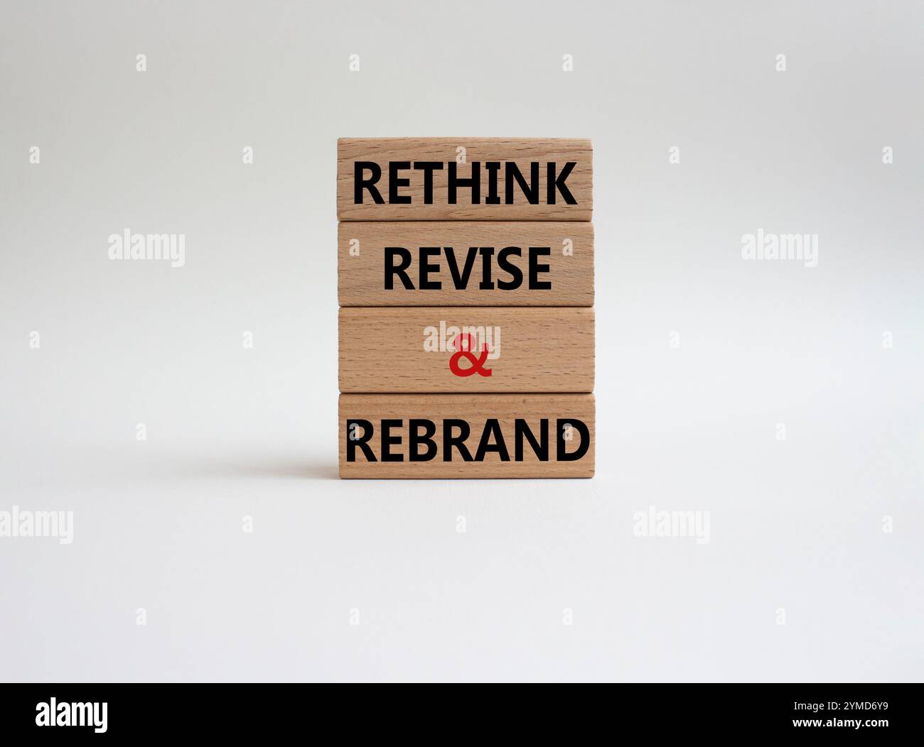 Rethink Revise and Rebrand symbol. Wooden blocks with words Rethink Revise and Rebrand ...