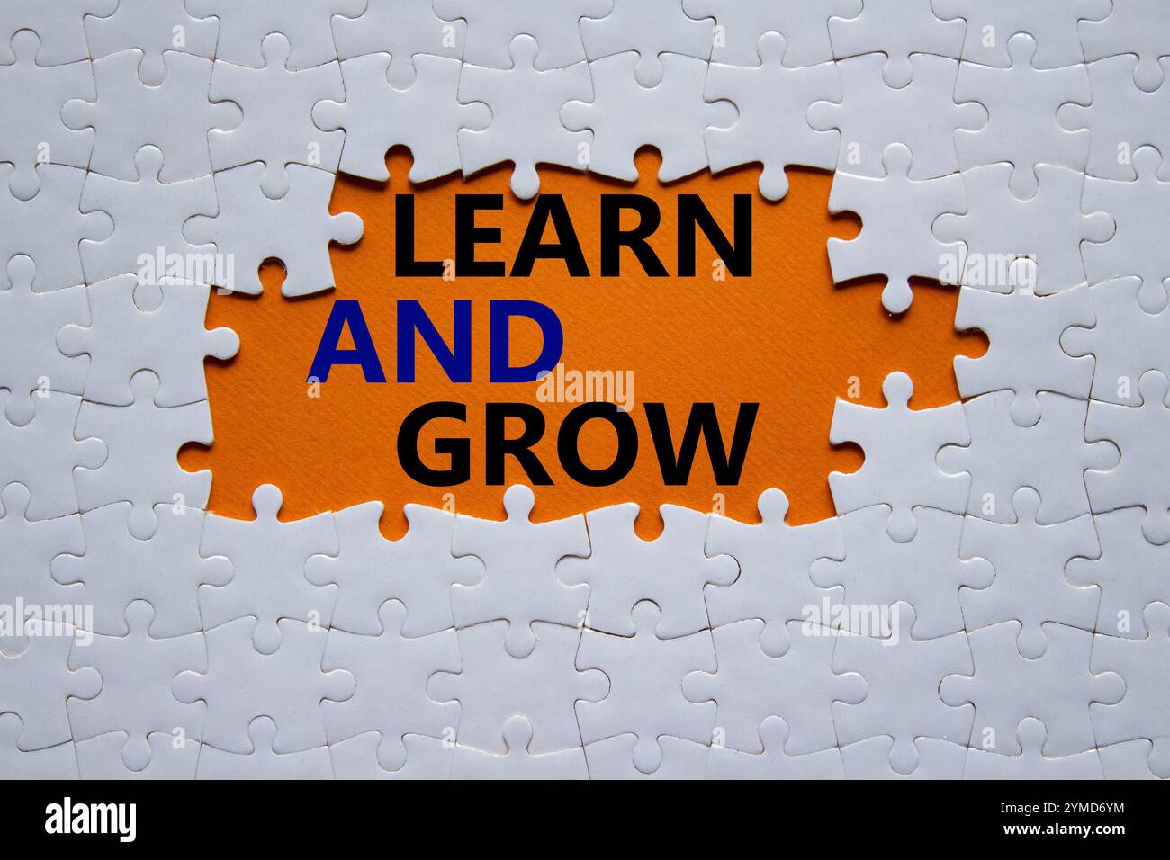 Learn and grow symbol. Concept words Learn and grow on white puzzle ...