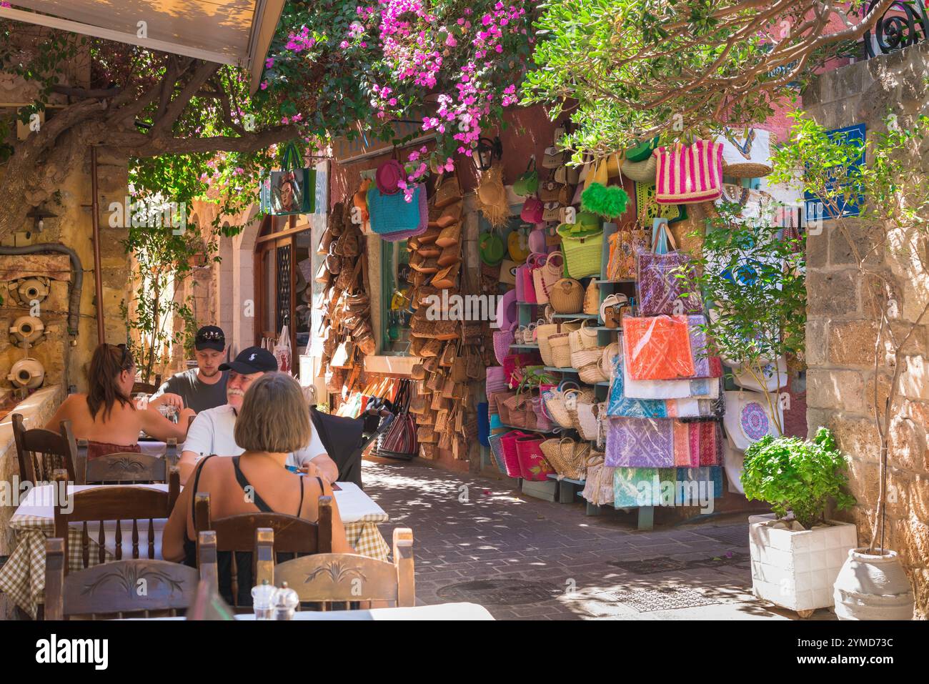 Crete old town, view of people sitting at open air cafe tables in a ...