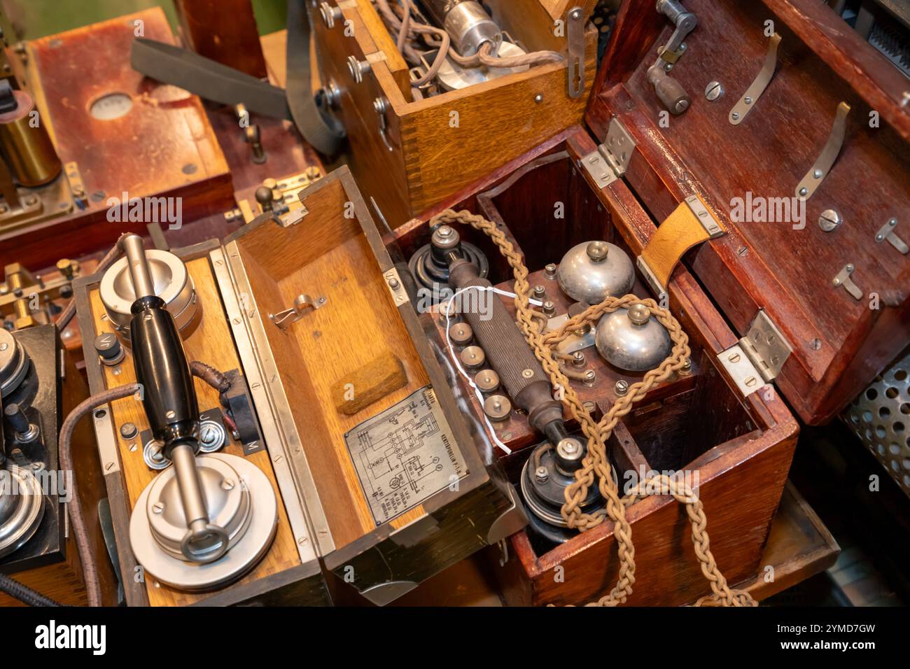 Old field telephones in wooden boxes, on display in the Elisa telephone ...