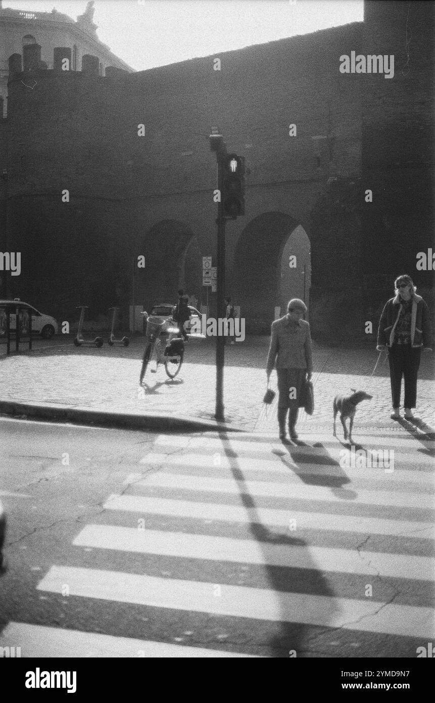 A peaceful afternoon in a historic European city, where pedestrians and ...