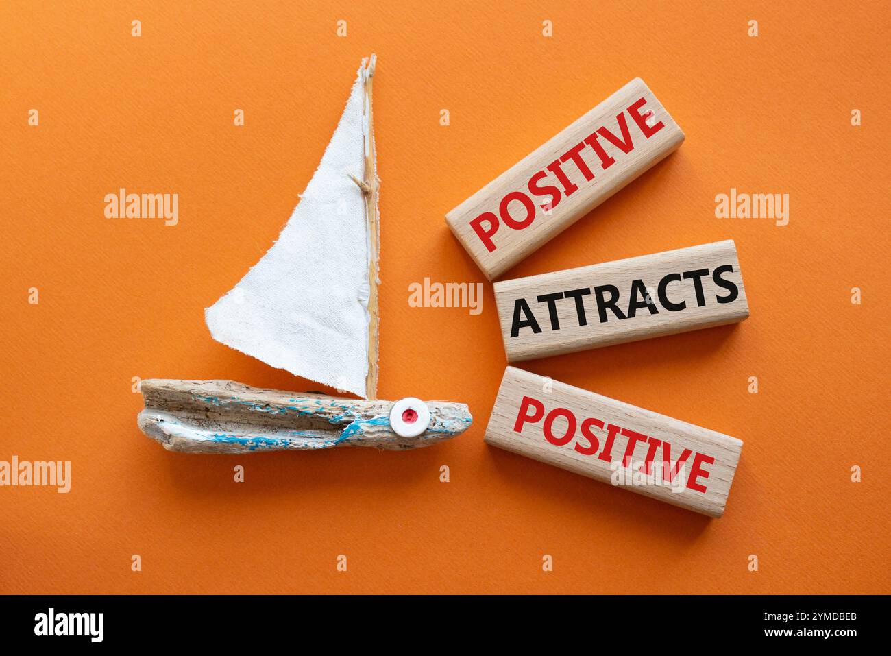 Positive attracts Positive symbol. Wooden blocks with words Positive ...
