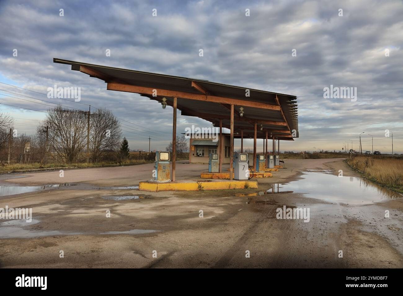 The ghostly remains of a long abandoned gas station years ago against ...
