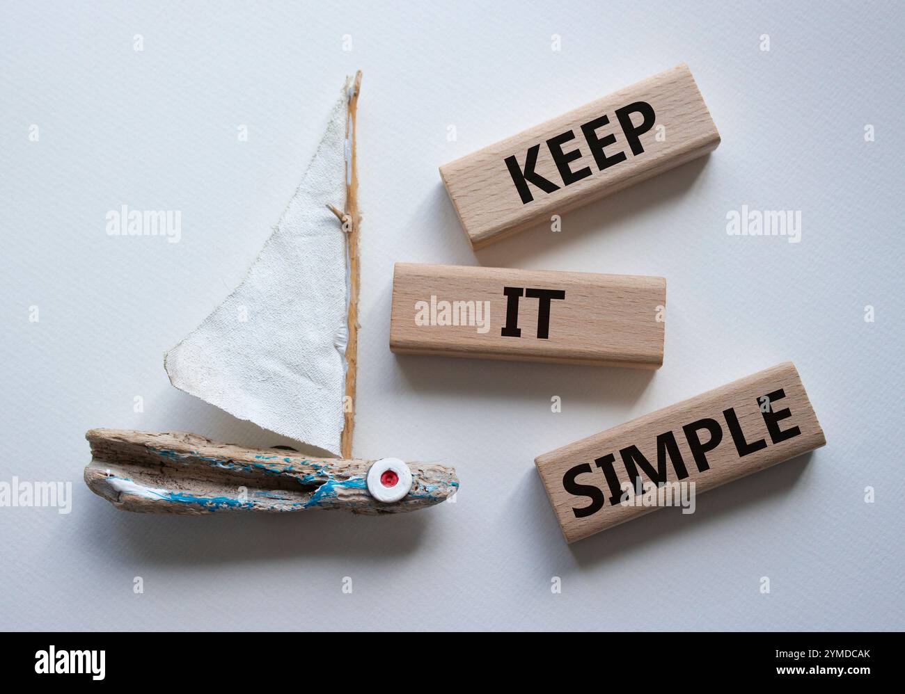 Keep it Simple symbol. Concept words Keep it Simple on wooden blocks ...