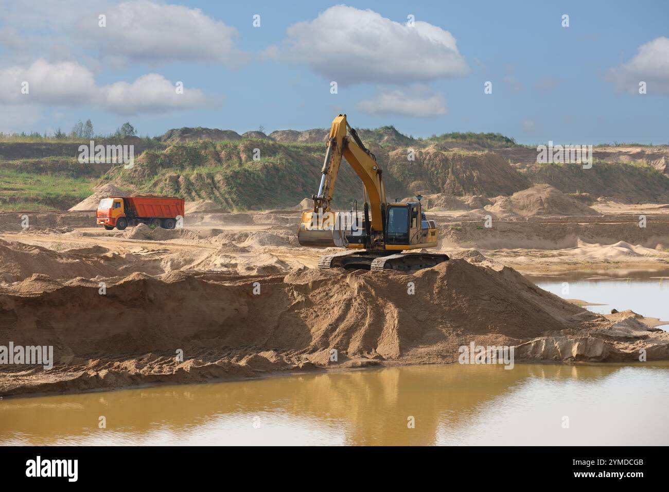 Heavy machinery - excavators and trucks working in the quarry Stock ...
