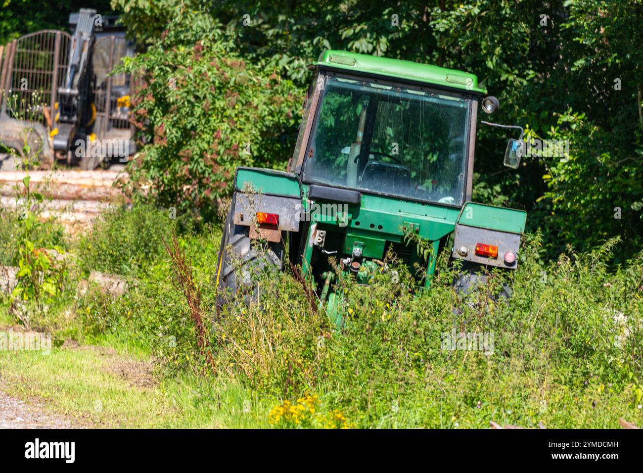 Tractor with forestry sawmill and logs. High quality photo Stock Photo ...