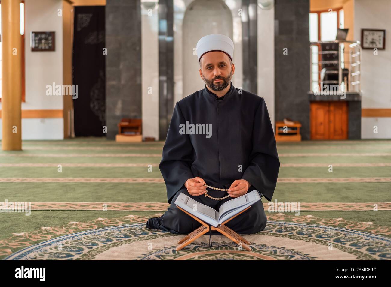 A Muslim man prayer praying inside the mosque Stock Photo - Alamy