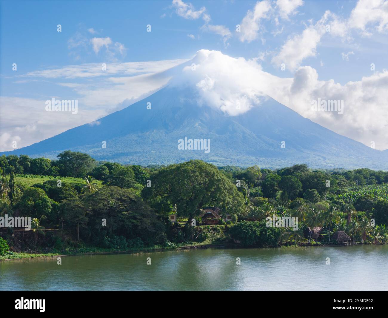Green lake shore with blue sky and volcano aerial Nicaragua landscape ...