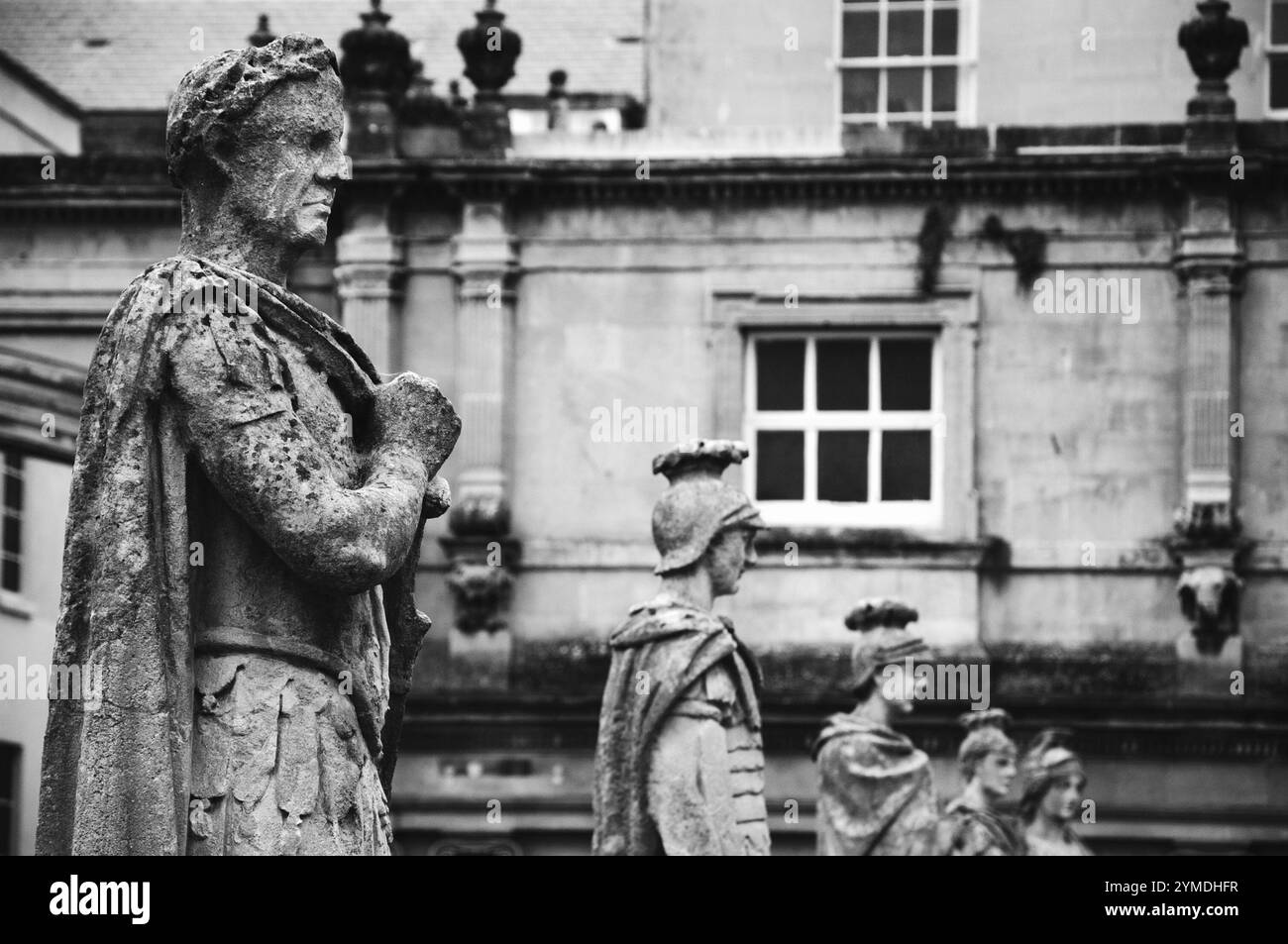 Stone statues of Roman warriors in Roman Baths complex in Bath, England ...