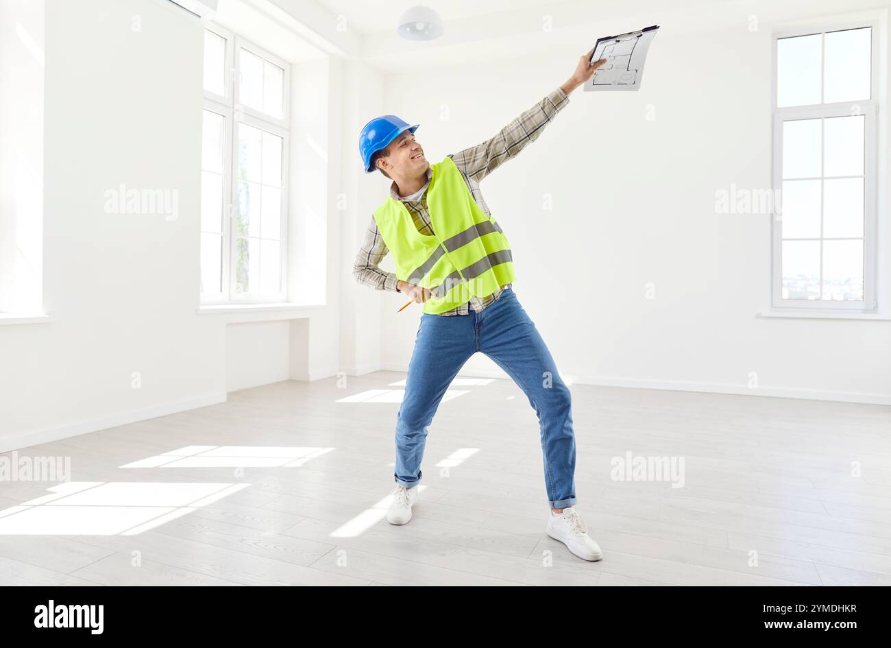 Happy young builder dancing construction hi-res stock photography and ...