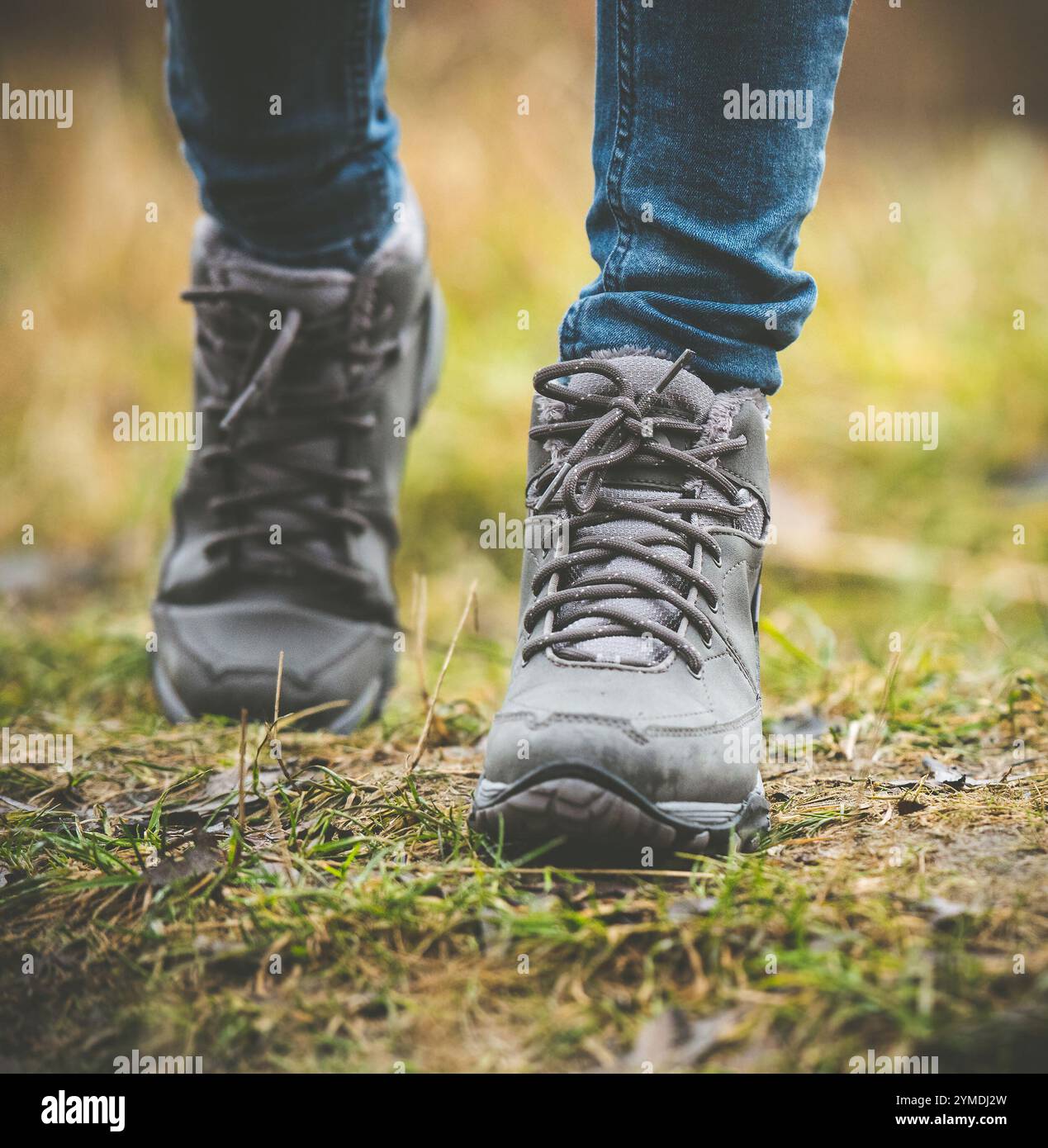 feet in shoes on a forest path Stock Photo - Alamy