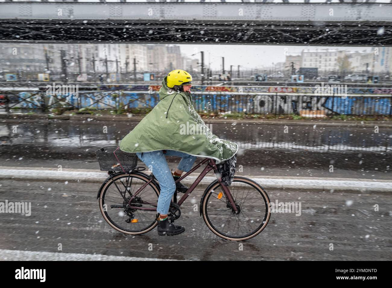 Illustration man on a bicycle with snow in Paris near the Sacre Coeur ...
