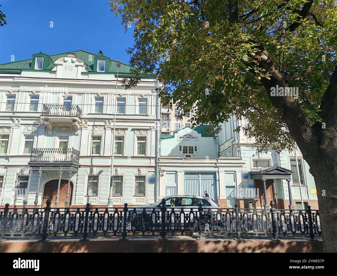 large two-story classical building with ornate detailing, large windows ...