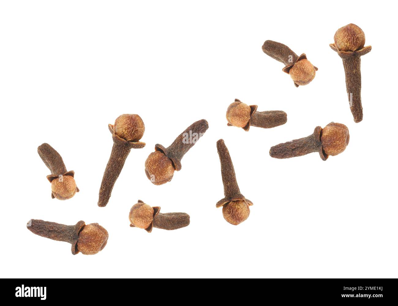 Clove buds in air on white background. Aromatic spice Stock Photo - Alamy