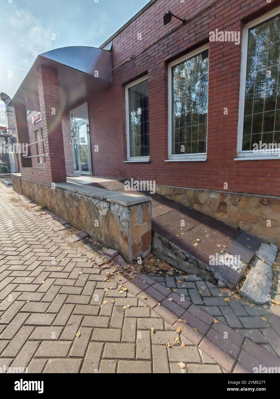 modern building facade made of red and gray bricks, with windows, air ...