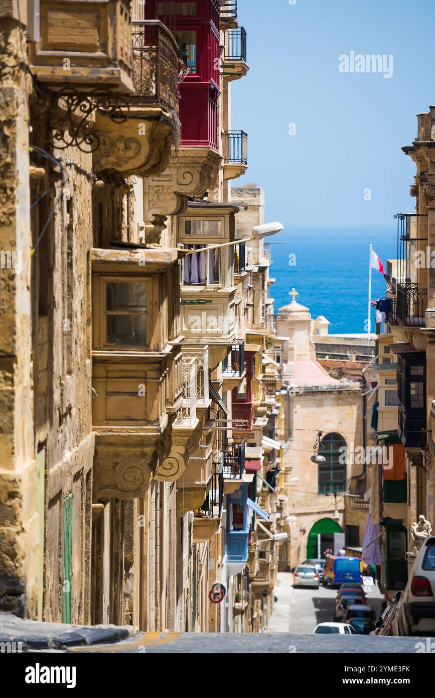 traditional Valletta street with balconies down to the sea in Malta ...