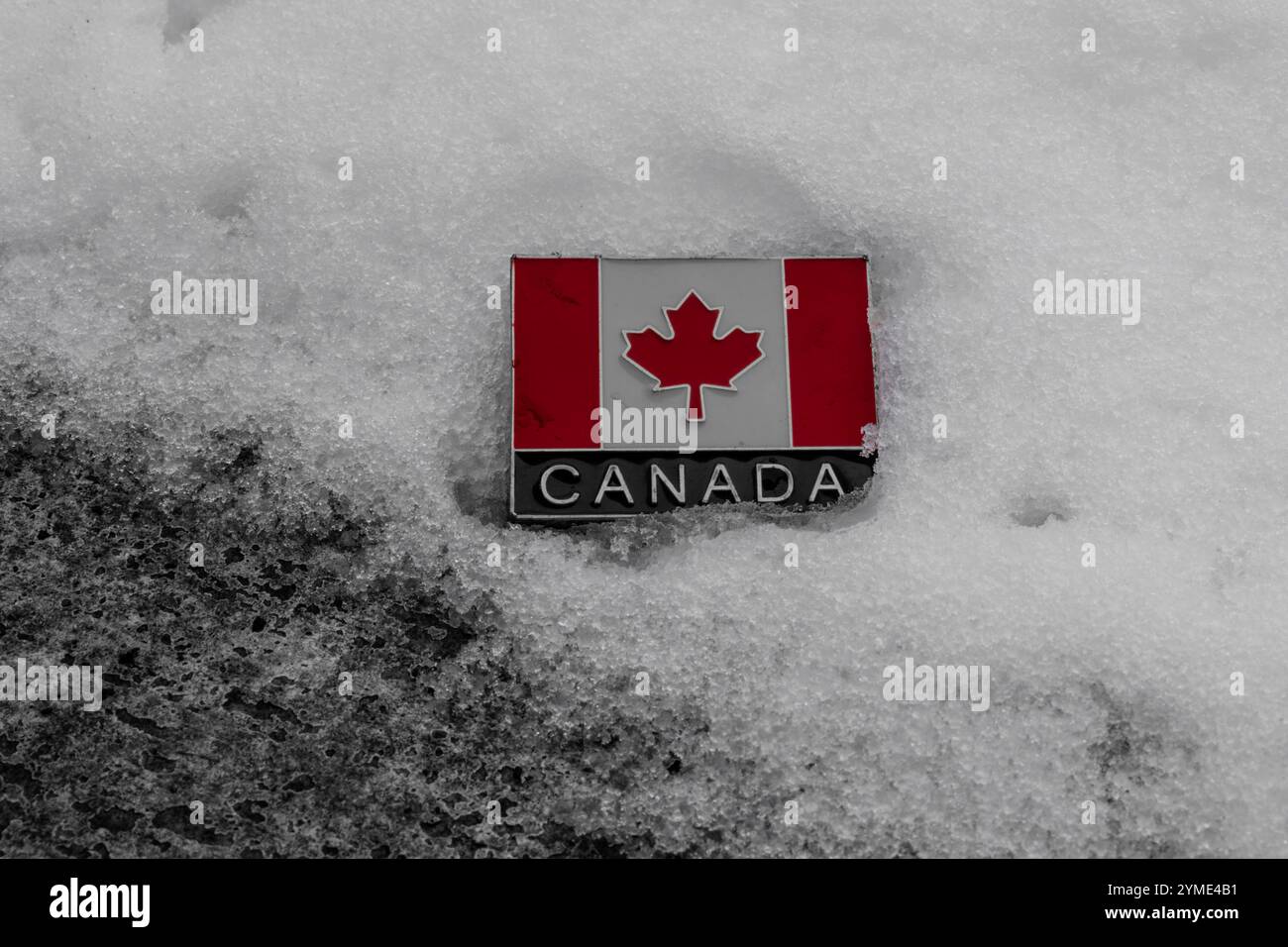 Canadian flag ornament on a snowy ground Stock Photo - Alamy
