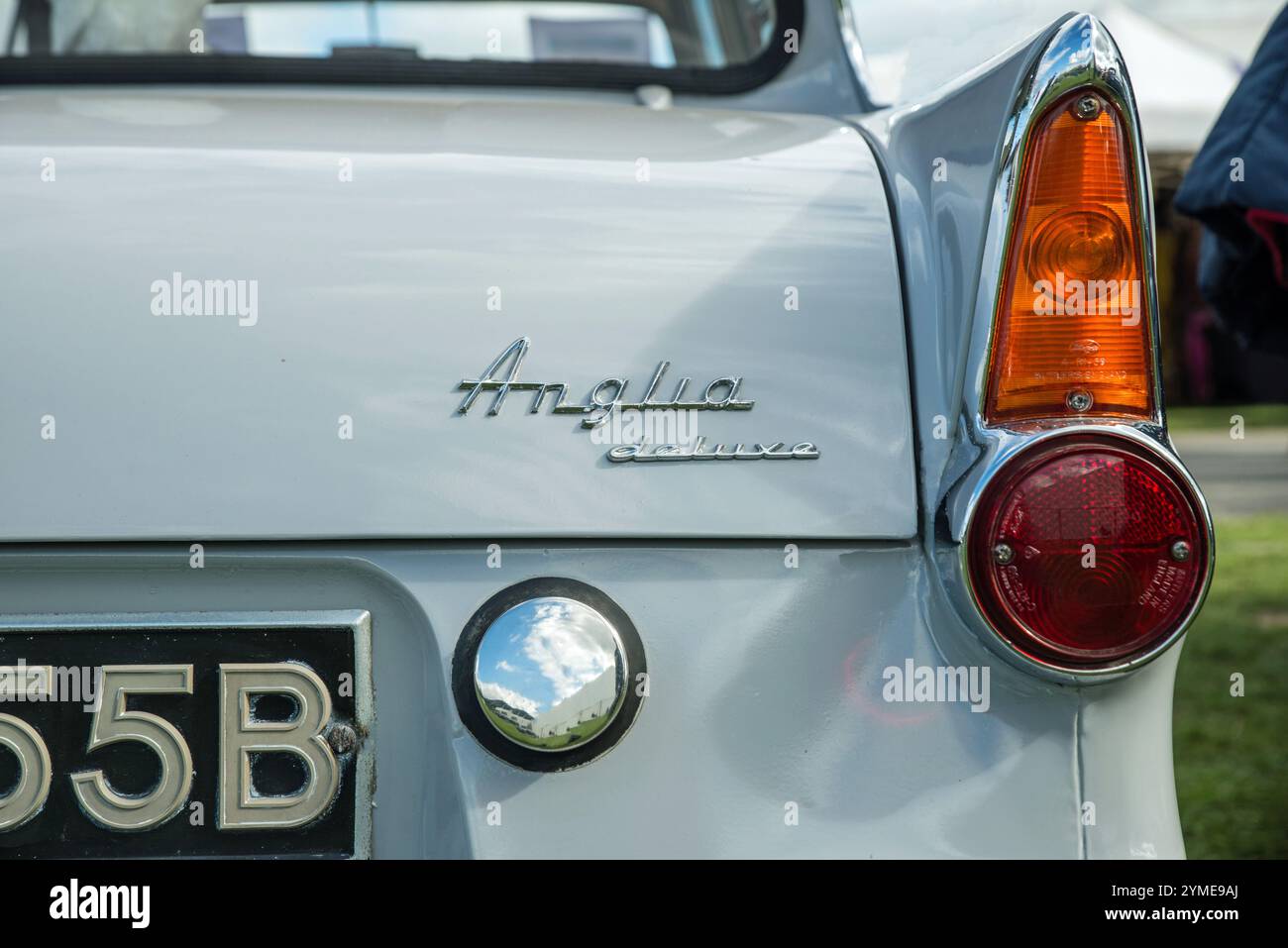 A rear corner view of a 1964 Ford Anglia Deluxe in light grey showing ...