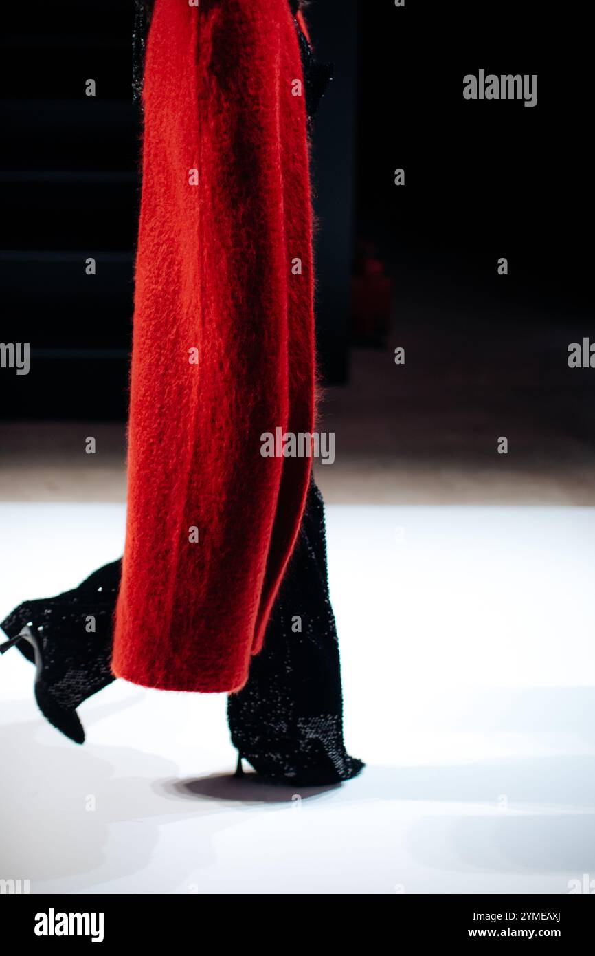 Long bright red autumnal cardigan and black high heels, minimal luxury ...