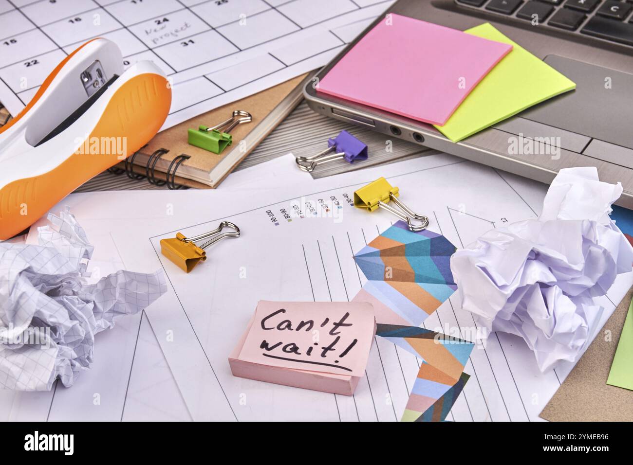 Close-up sticky notes with cant wait handwriting and office stuff. Work ...