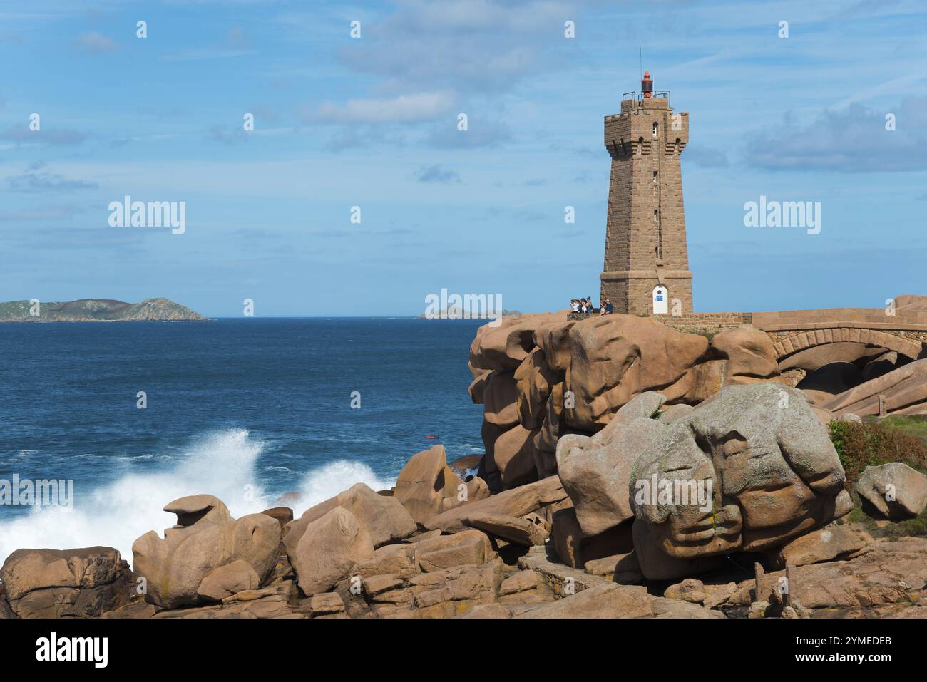 Lighthouse on a rocky shore with breaking waves, Phare de Men Ruz ...