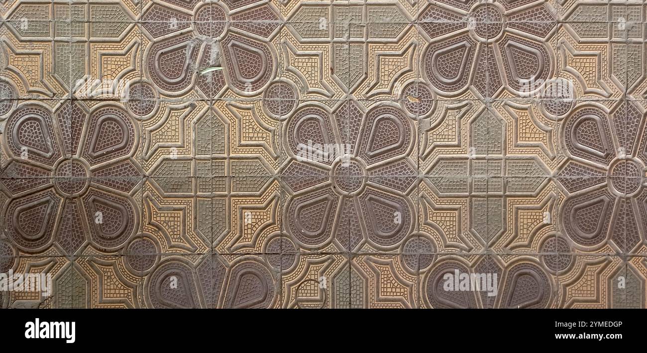 Colorful sidewalk tiles with geometric shapes in an urban environment ...