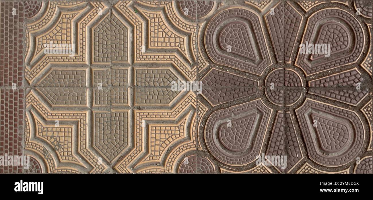 Colorful sidewalk tiles with geometric shapes in an urban environment ...