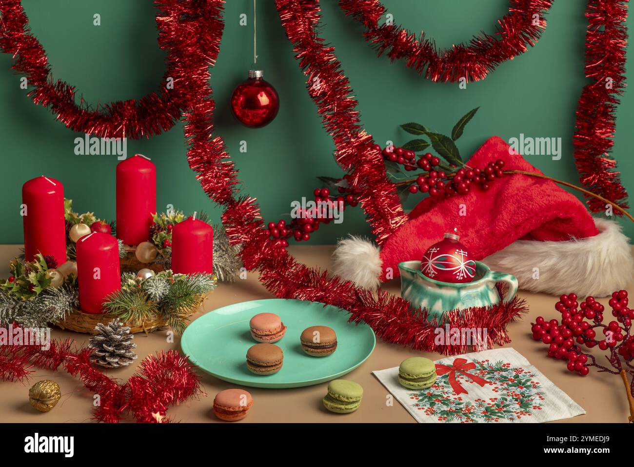 Christmas scene with red candles on an Advent wreath, garlands and ...