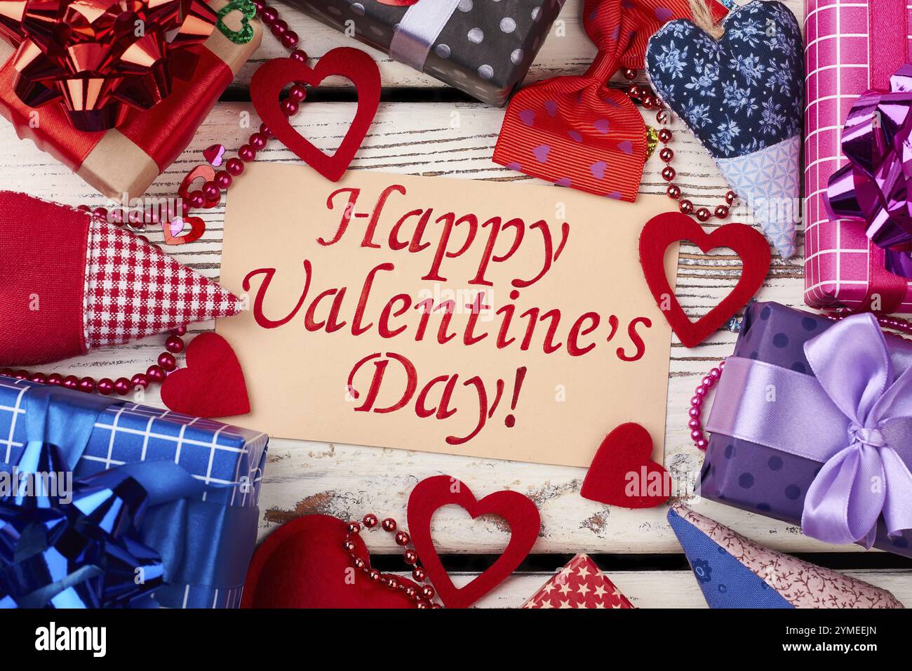 Valentine's Day card and presents. Fabric hearts, bow, bead garland ...