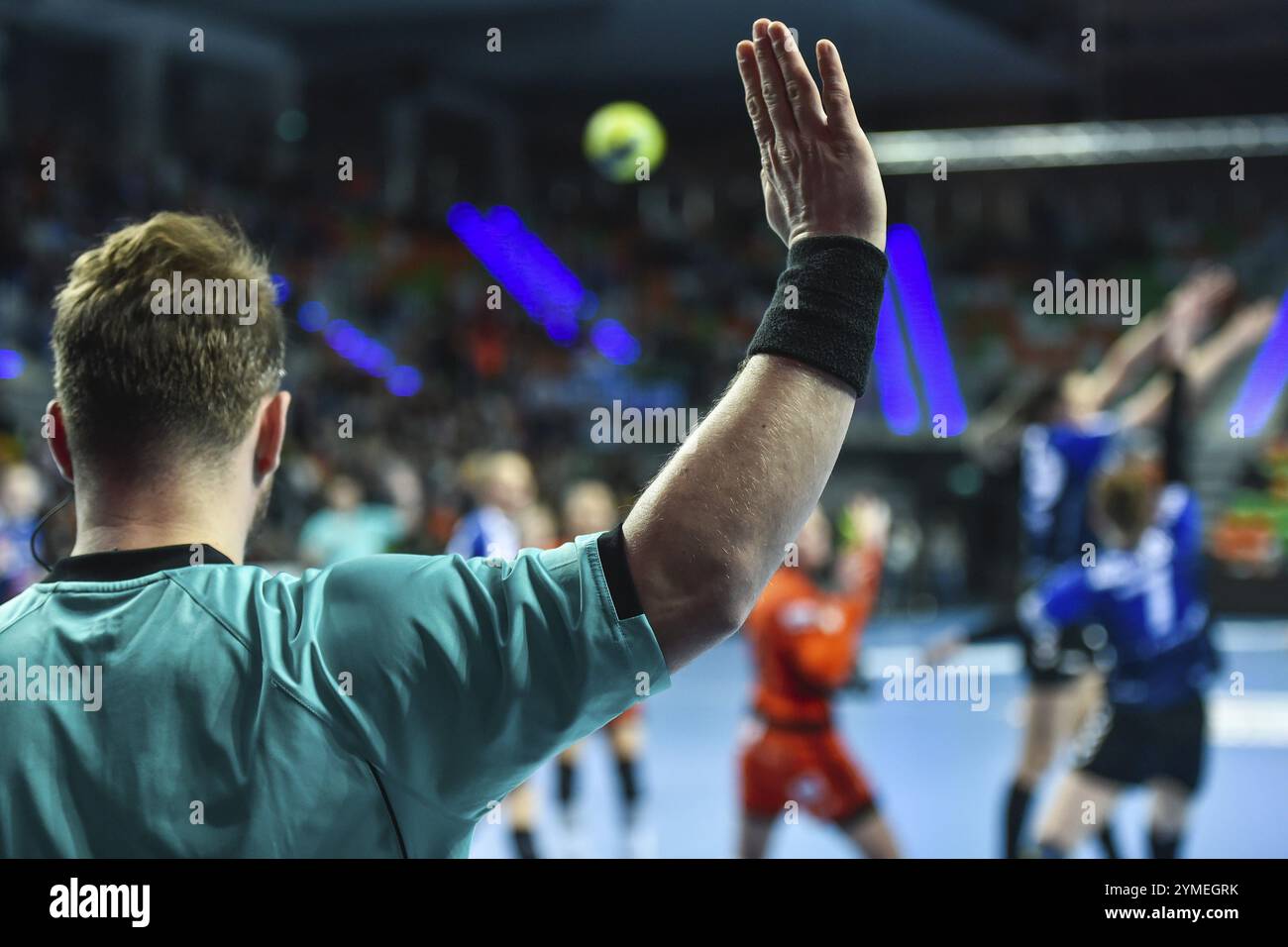 Handball referee gives signal playing for time during handball match ...