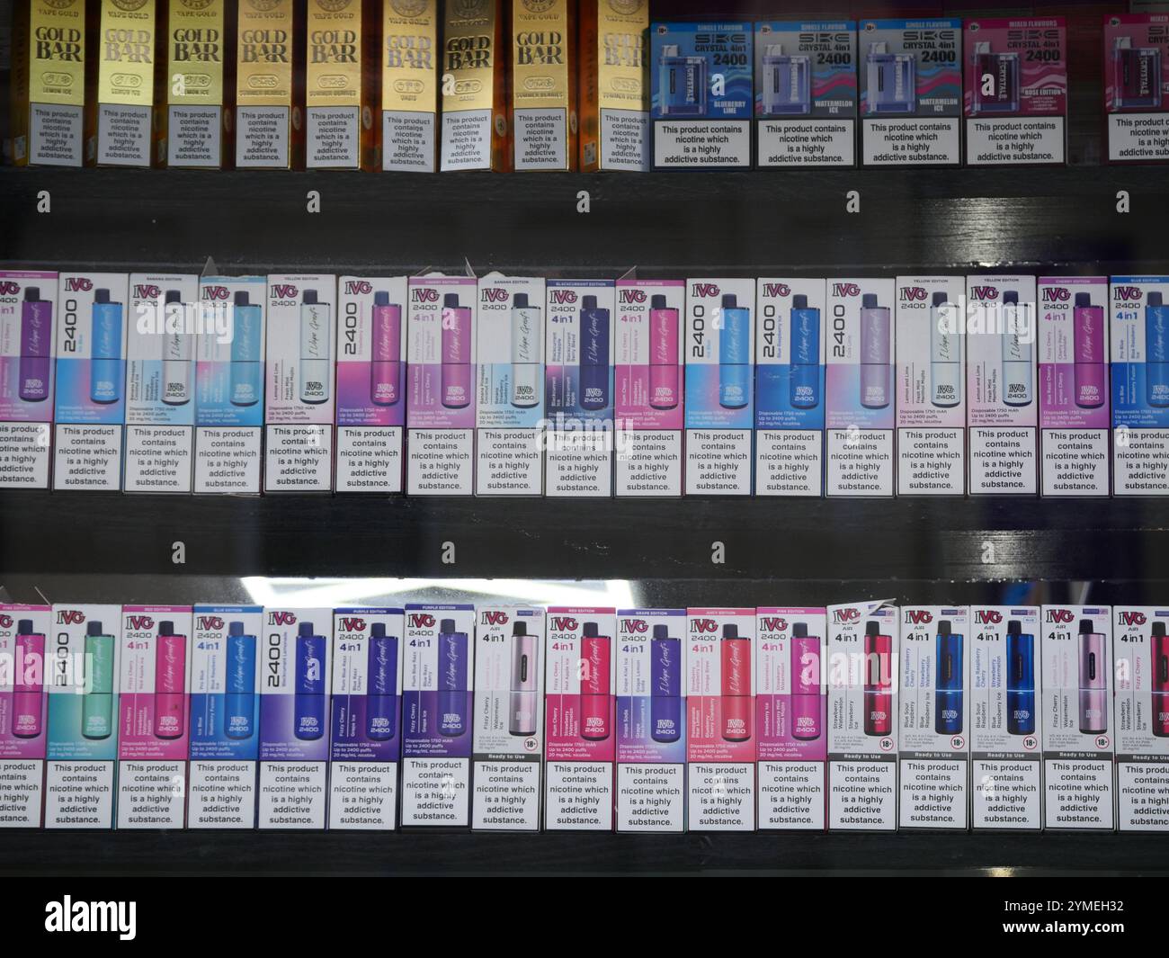 Vape shop display of colourful disposable vape pens and vaping products ...