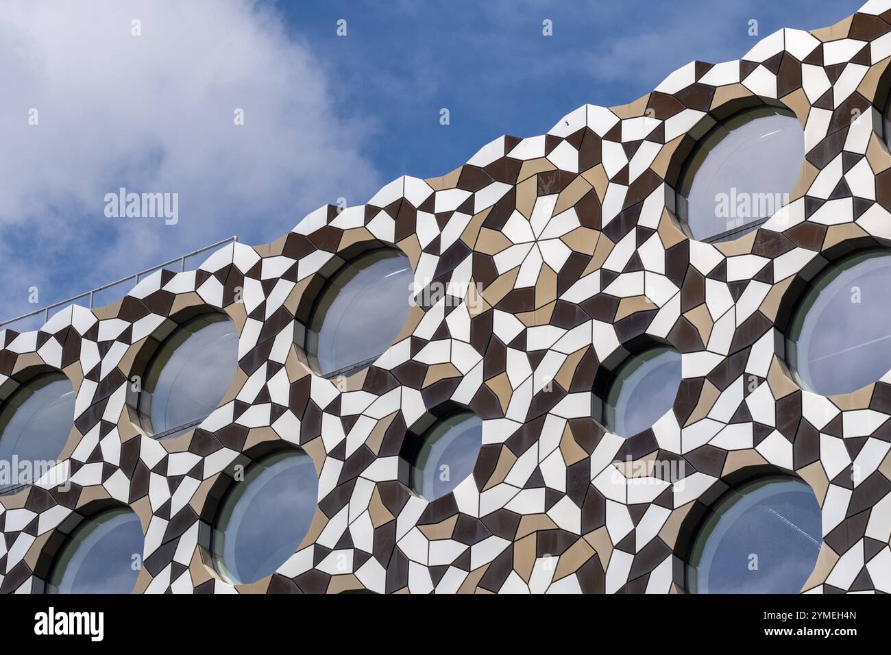 Architectural facade featuring circular windows and intricate geometric ...