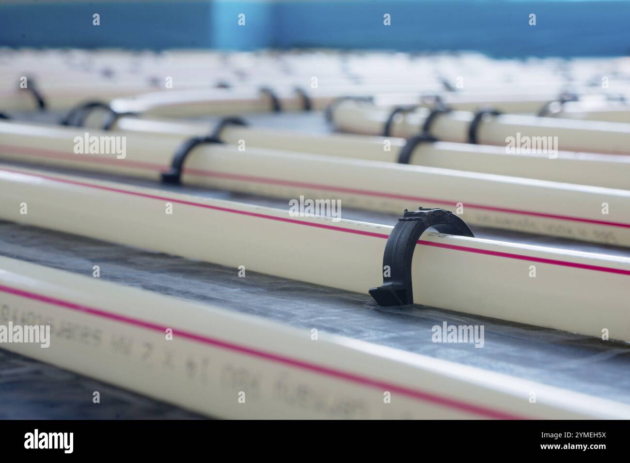 Underfloor heating pipes in bifilar installation form Stock Photo - Alamy