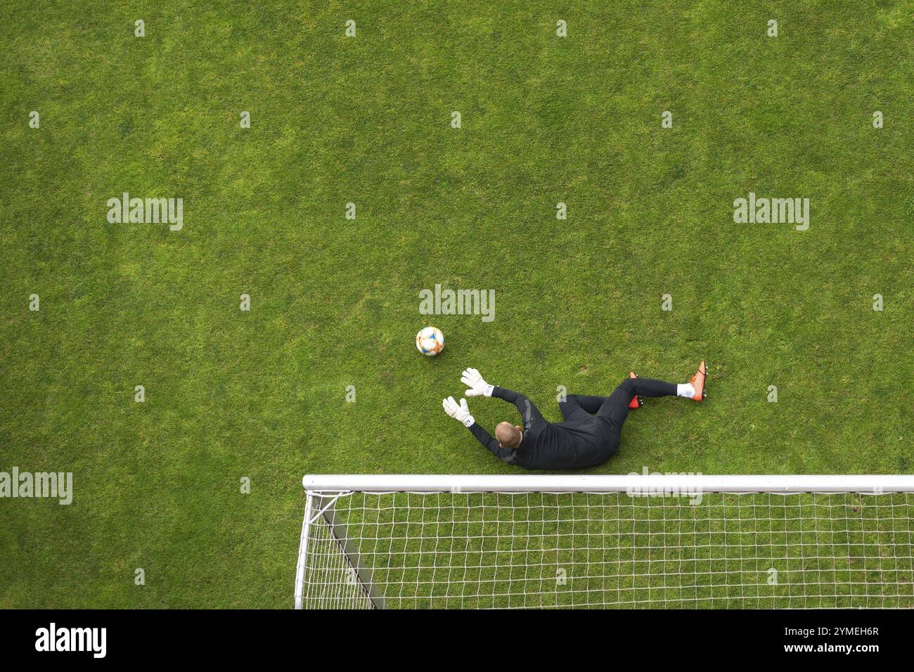 Soccer goalkeeper goalkeeper intervention - view from above Stock Photo ...