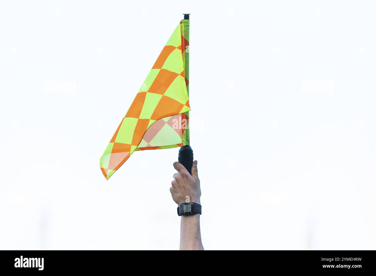 Raised flag by assistant of football referee Stock Photo - Alamy