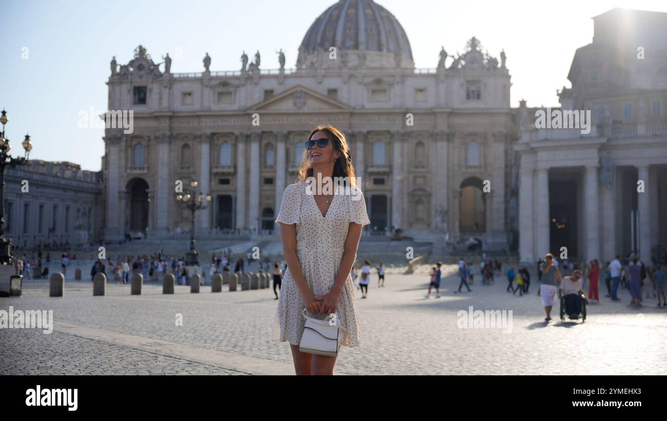 Elegant traveler enjoying Vatican City iconic landmarks and cultural atmosphere Stock Photo - Alamy