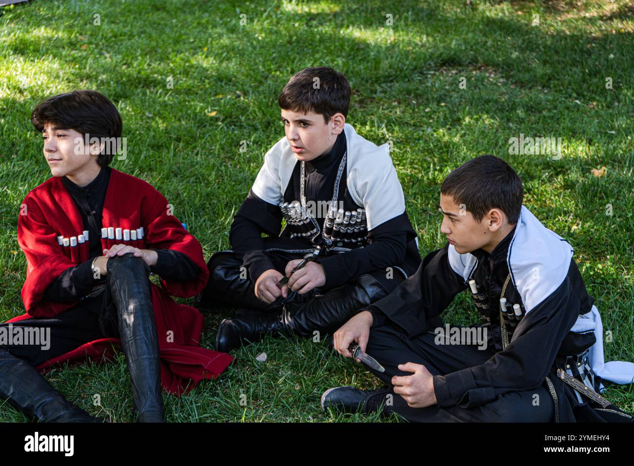05 October 2024, Tbilisi, Georgia, Boys in traditional Georgian clothes ...