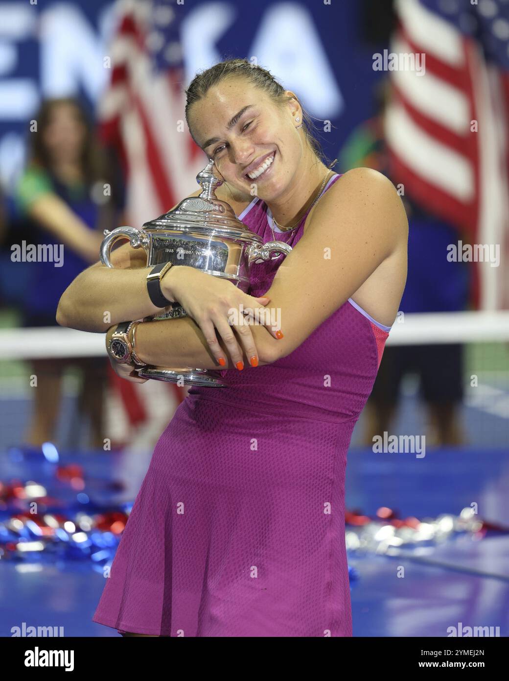 Tennis player Aryna Sabalenka hugging the trophy during the ...