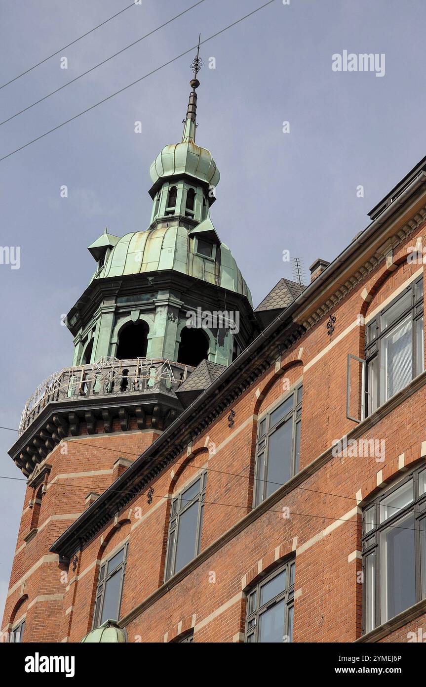 Historic tower with green roof on a brick building, copenhagen, denmark ...