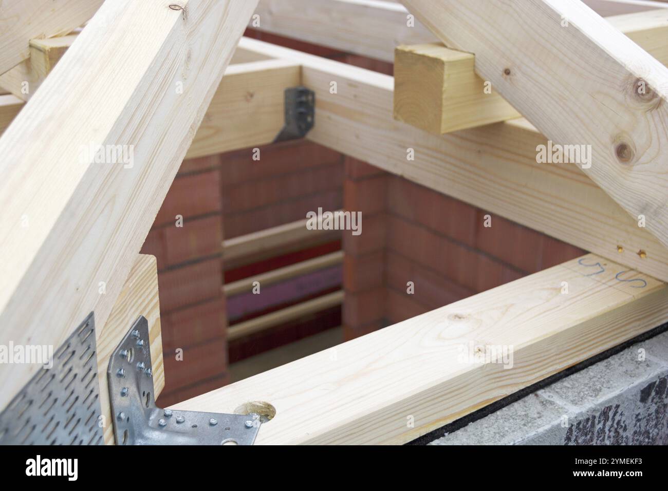 Shell construction with roof truss of urban villa Stock Photo - Alamy