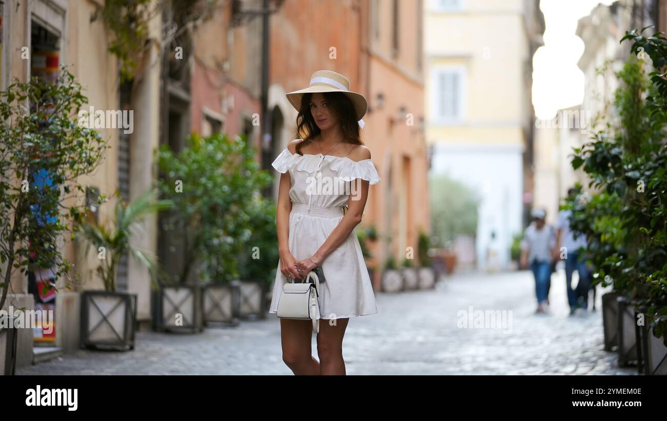 Elegant Tourist Exploring a Beautiful Cobblestone Street in Rome Stock ...