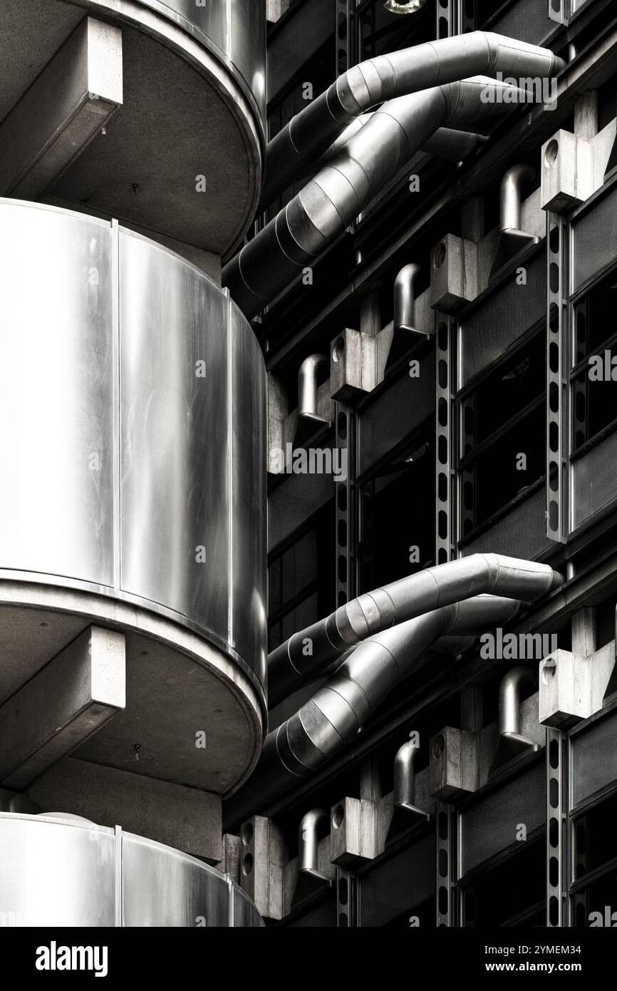 Industrial building facade with reflective metal elements and exposed ...