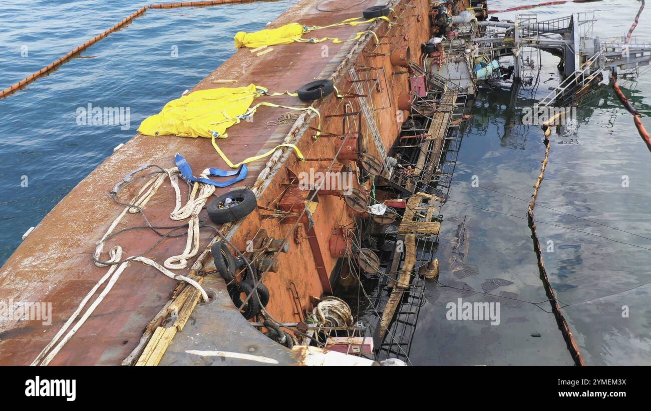 Drowned ship after the wreck. Overturned rusty oil tanker ship in ...