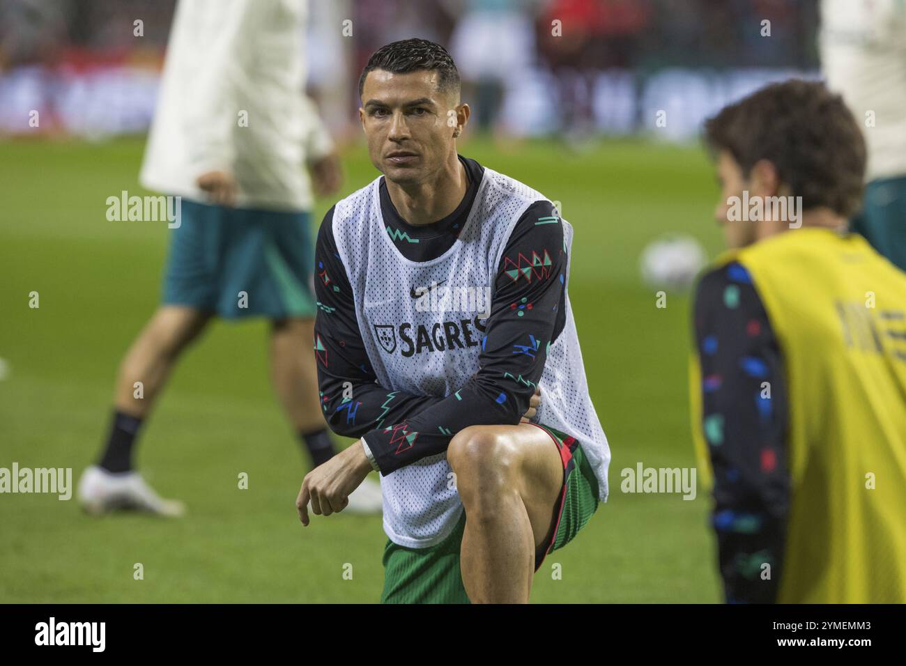 Football match, Cristiano RONALDO CR7 Portugal kneeling while warming up in front of the match ...