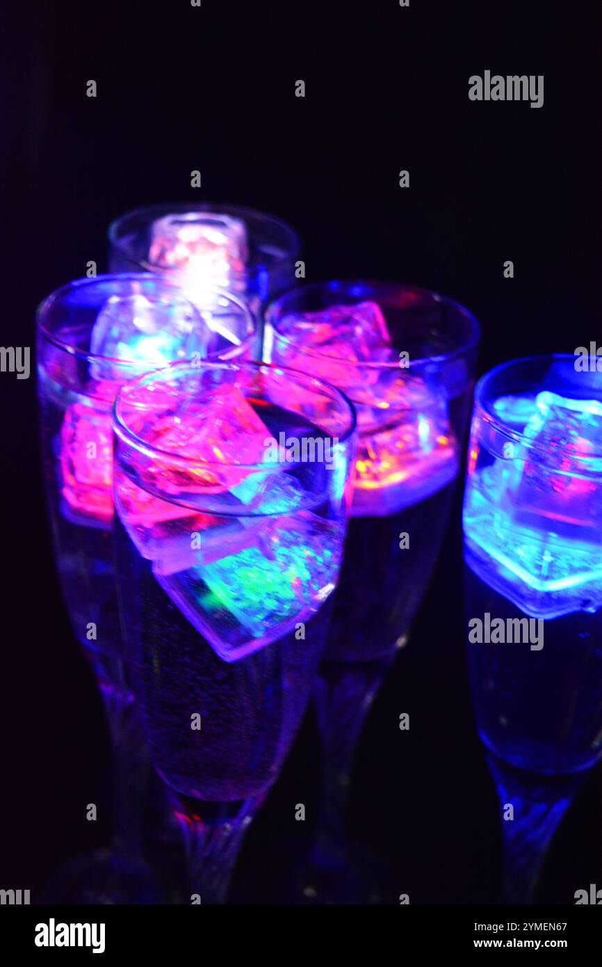 Colorful glasses, champagne glasses with fizzy drink, carbonated sweet ...