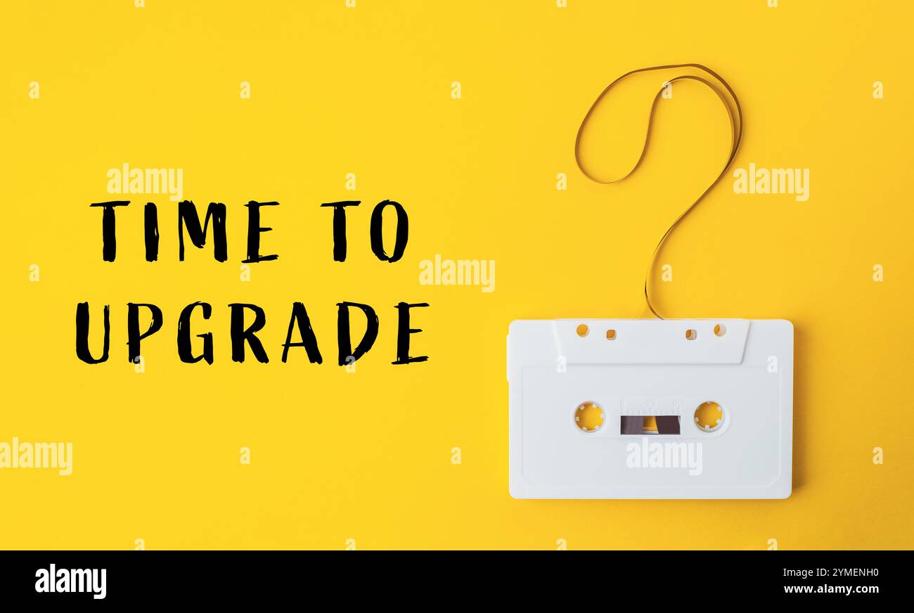 White cassette tape is hanging from a string with a question mark on it ...