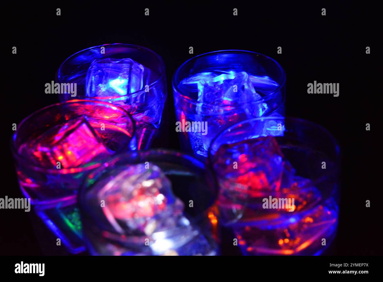 Colorful glasses, champagne glasses with fizzy drink, carbonated sweet ...