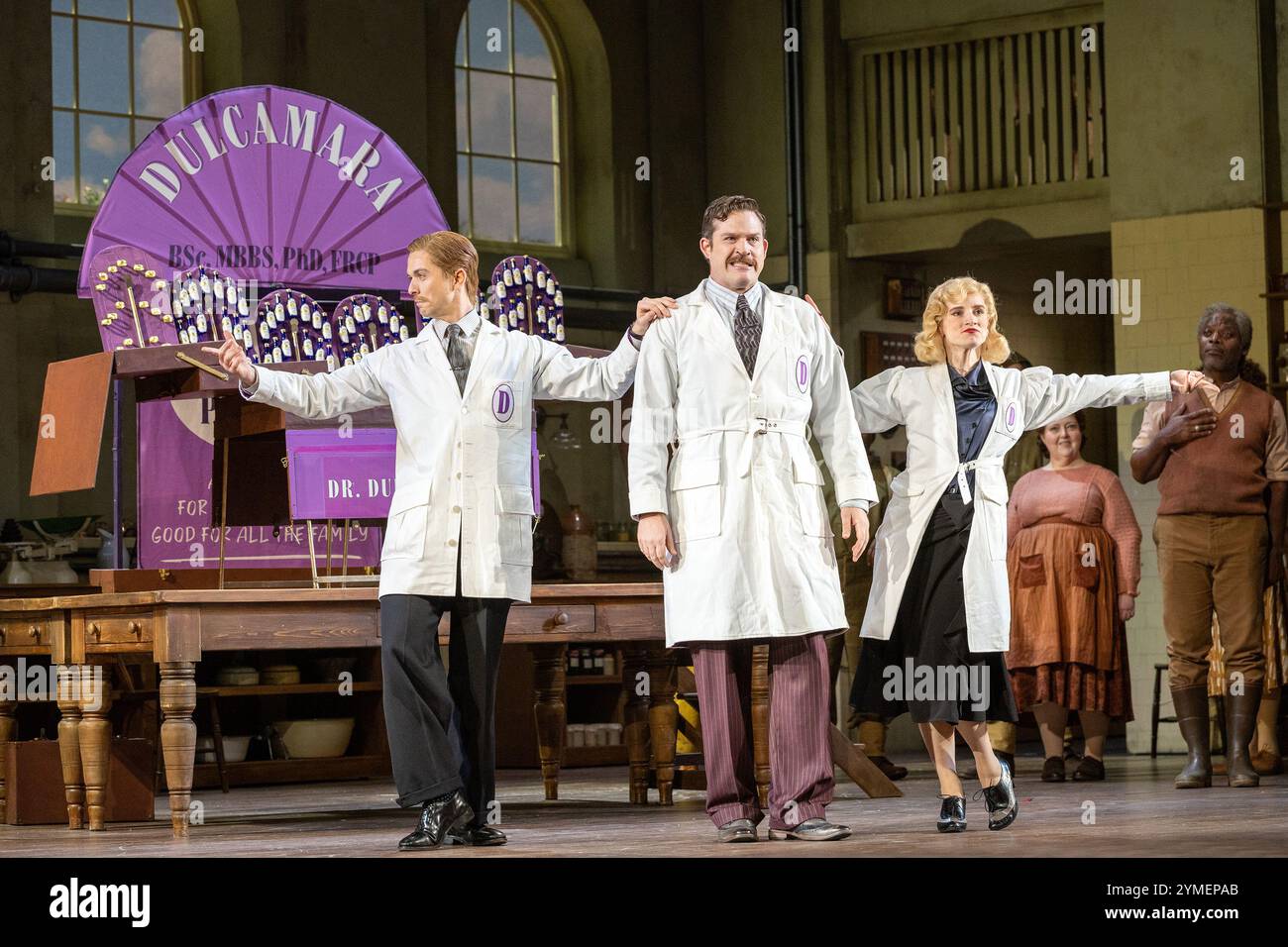 l-r: Reece Causton, Brandon Cedel (Dulcamara), Bridget Lappin in THE ELIXIR OF LOVE at English ...